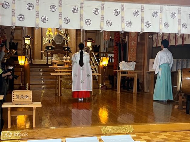 Experience dressing up in a shrine maiden costume and visiting a shrine ...