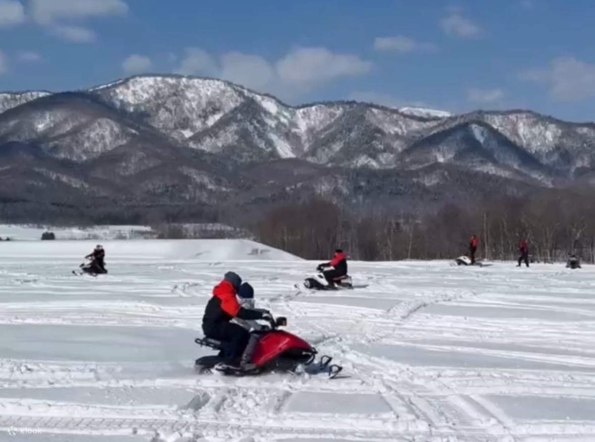 Hokkaido Snowmobiling Experience with Hot Drink & Photo Souvenir ...