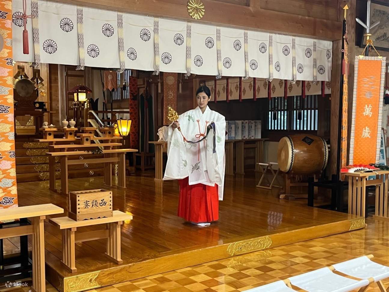 Experience dressing up in a shrine maiden costume and visiting a shrine ...